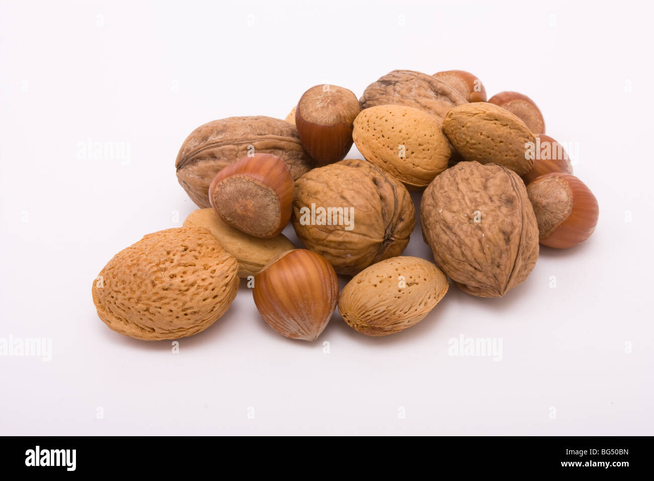 Festive Mixed Nuts of hazelnuts, walnuts and almonds isolated against ...