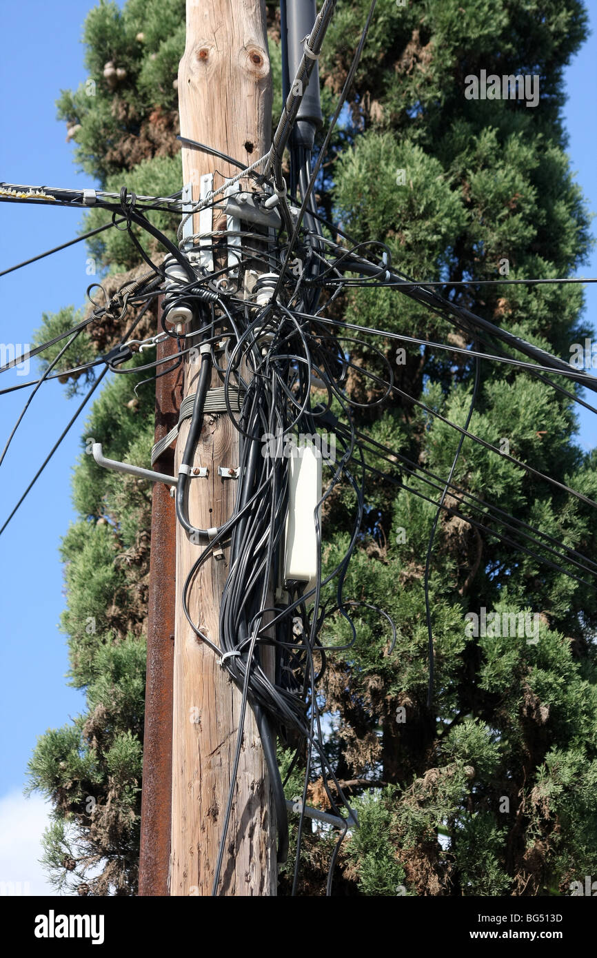 Tangle of electrical wiring on post in Magalluf Stock Photo - Alamy