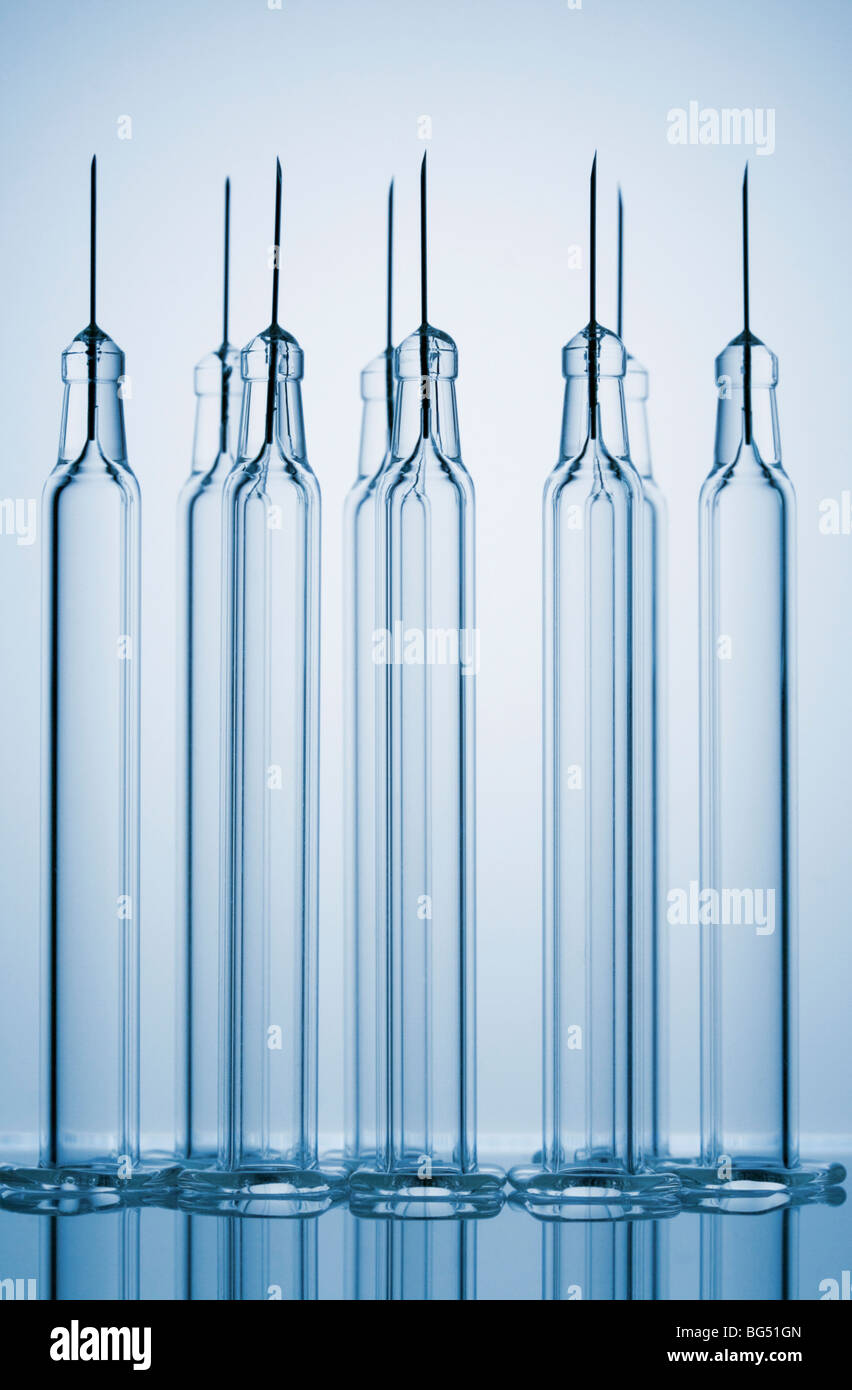 Some vertical syringes Stock Photo - Alamy