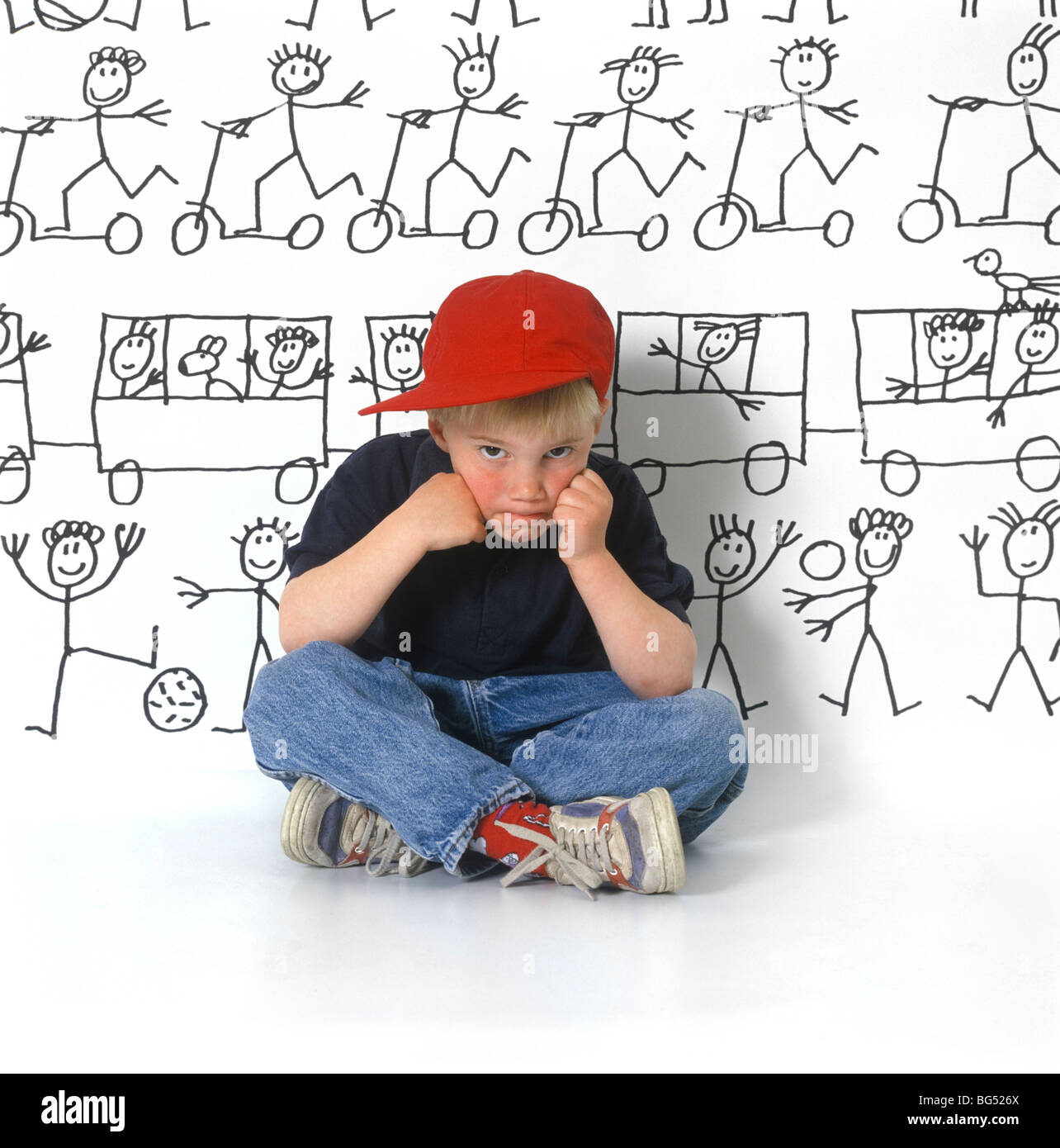 Angry little boy with a red cap Stock Photo - Alamy