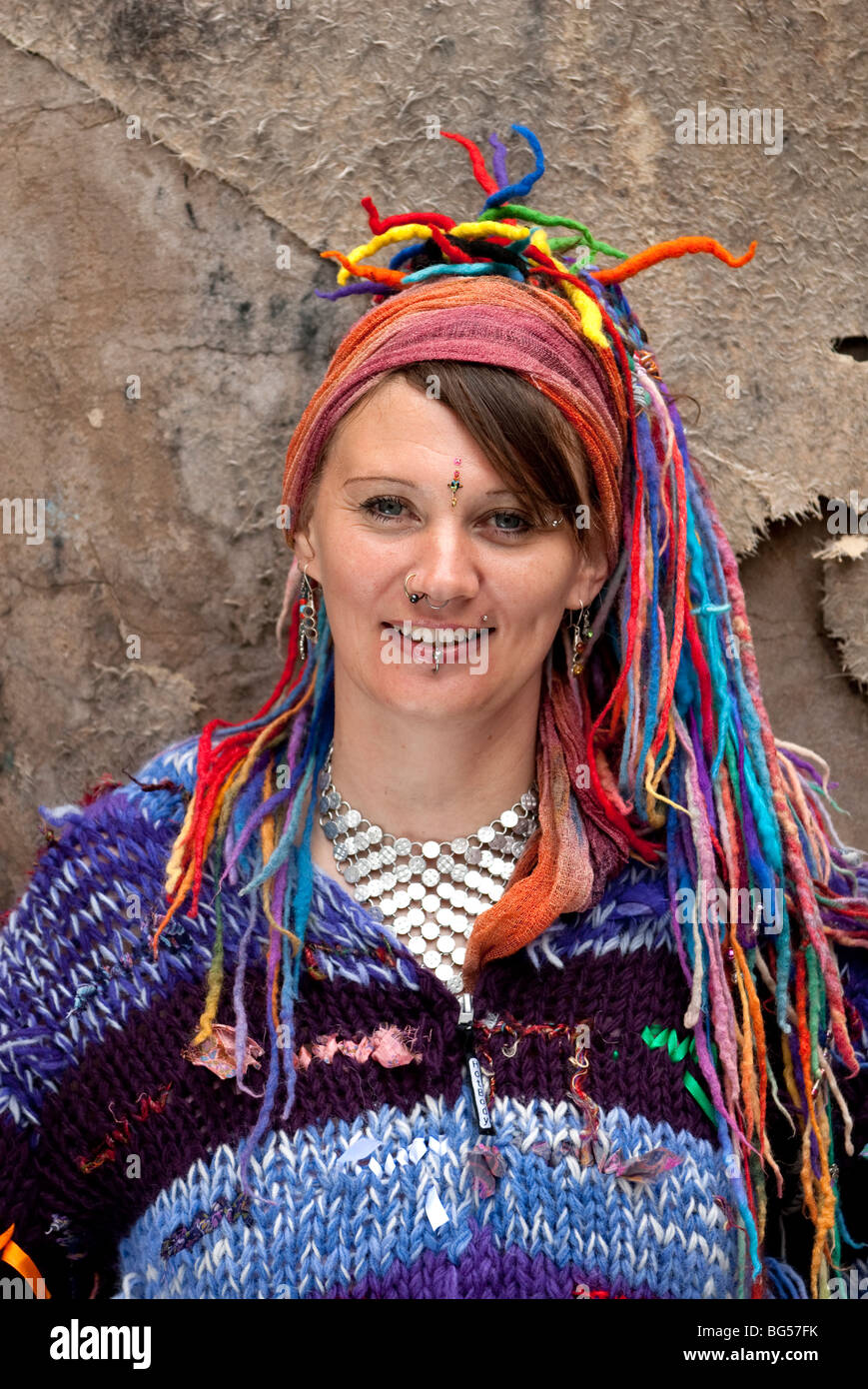 Young woman Hippy with multi coloured hair and alternative clothing ...