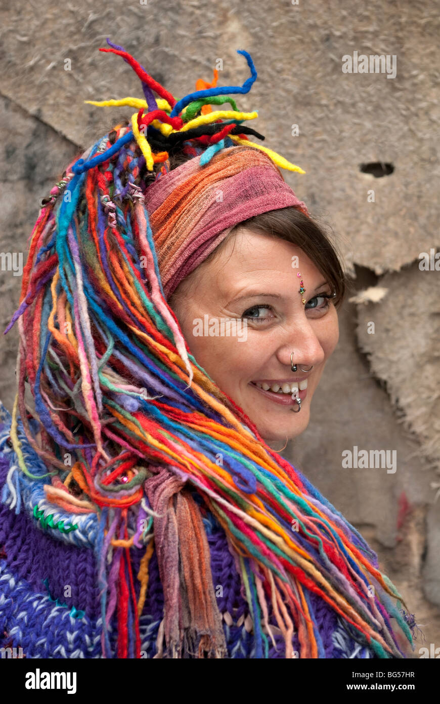 Young woman Hippy with multi coloured hair and alternative clothing ...