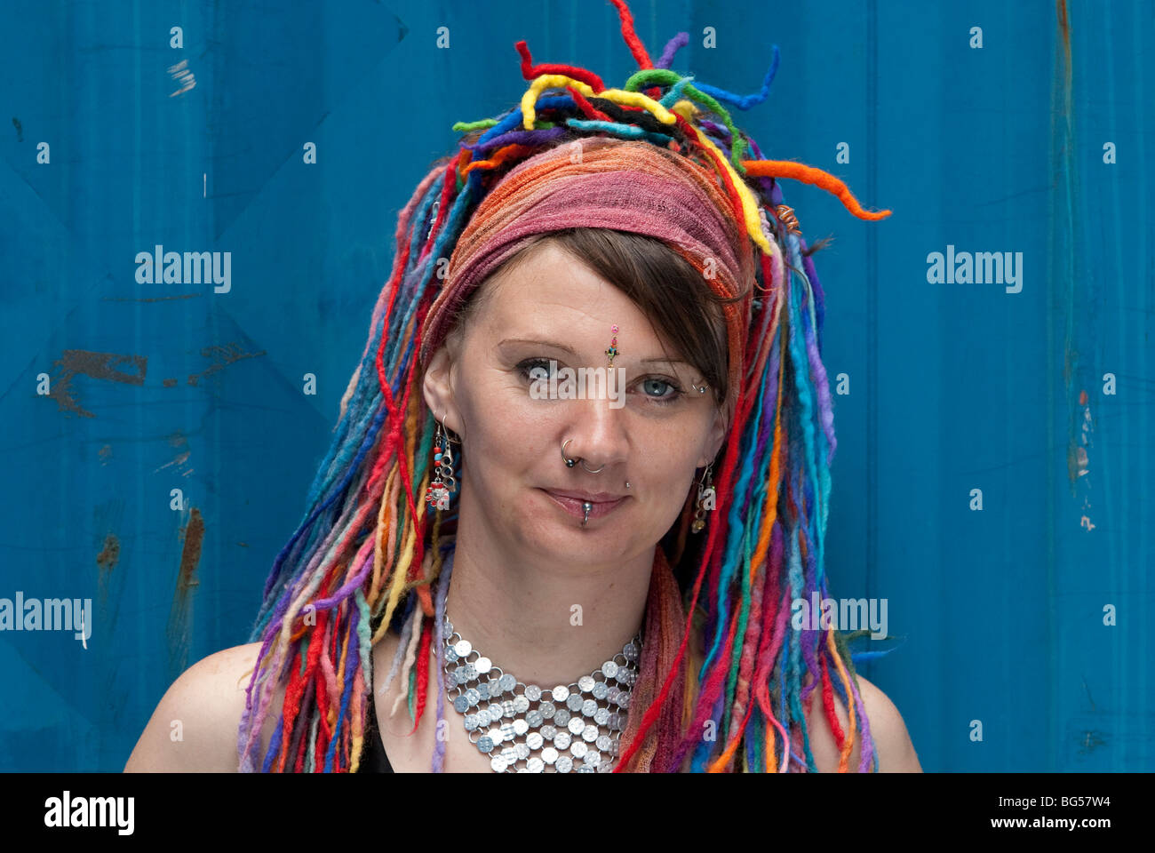 Young woman Hippy with multi coloured hair and alternative clothing ...