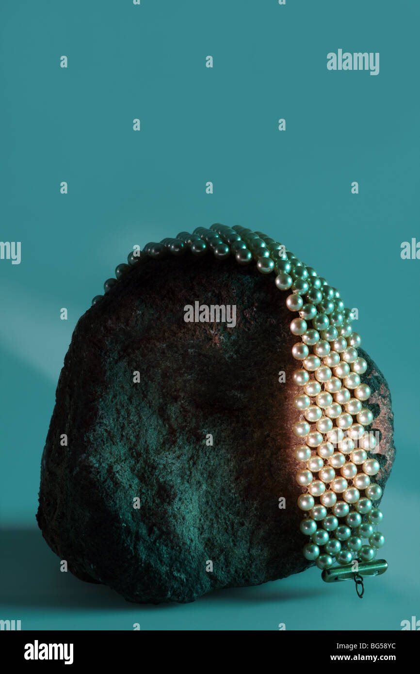 pearl necklace on the rock Stock Photo - Alamy