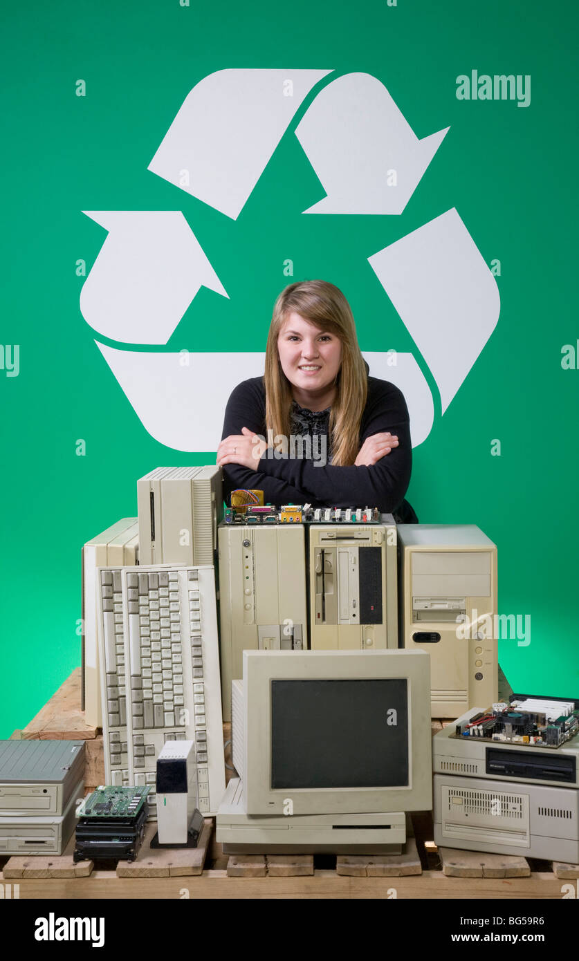 Woman recycling computers Stock Photo - Alamy