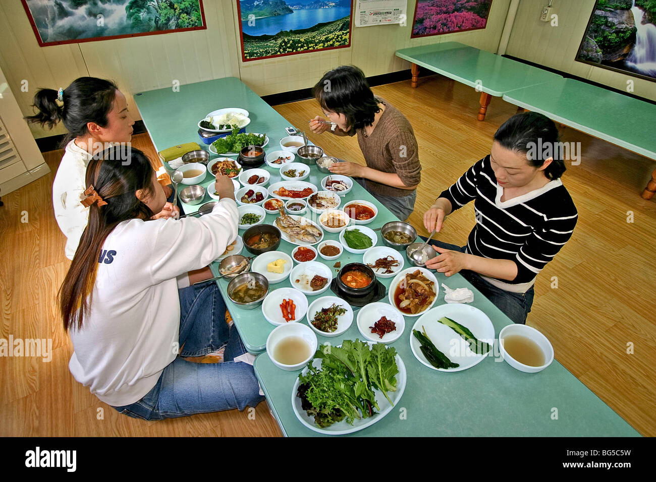 Eating a traditional Korean meal with many side dishes Stock Photo - Alamy