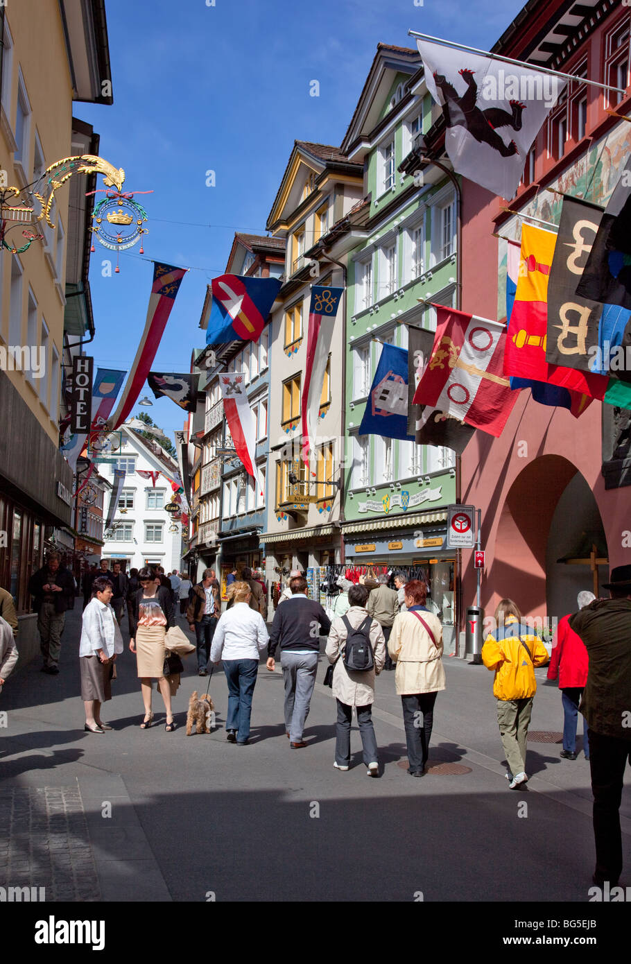 People walking in the Appenzell main street decorated with local ...