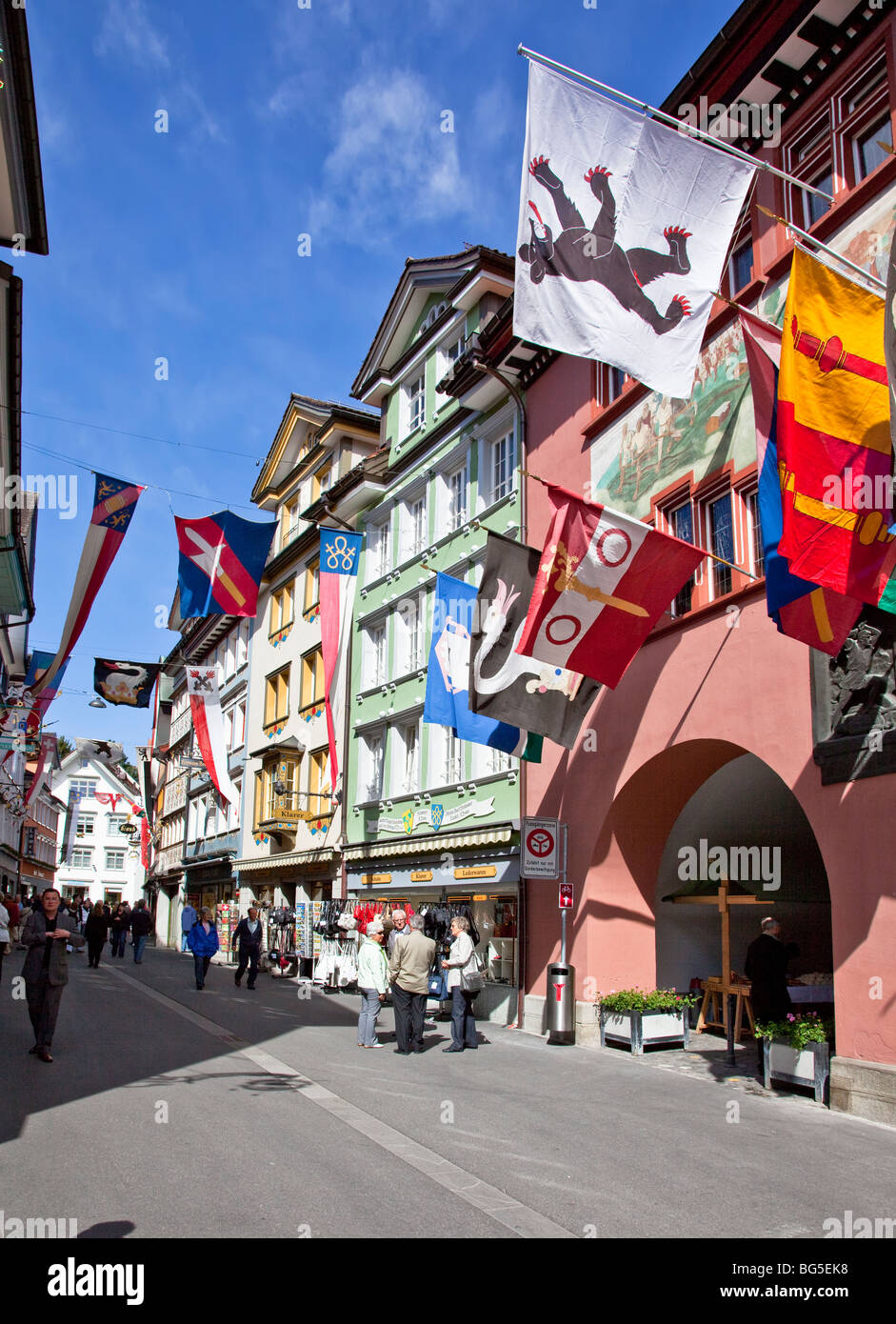 People walking in the Appenzell main street decorated with local ...