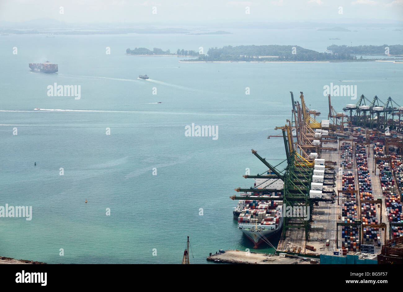 An elevated view shows a container ship docked at at the Port of ...