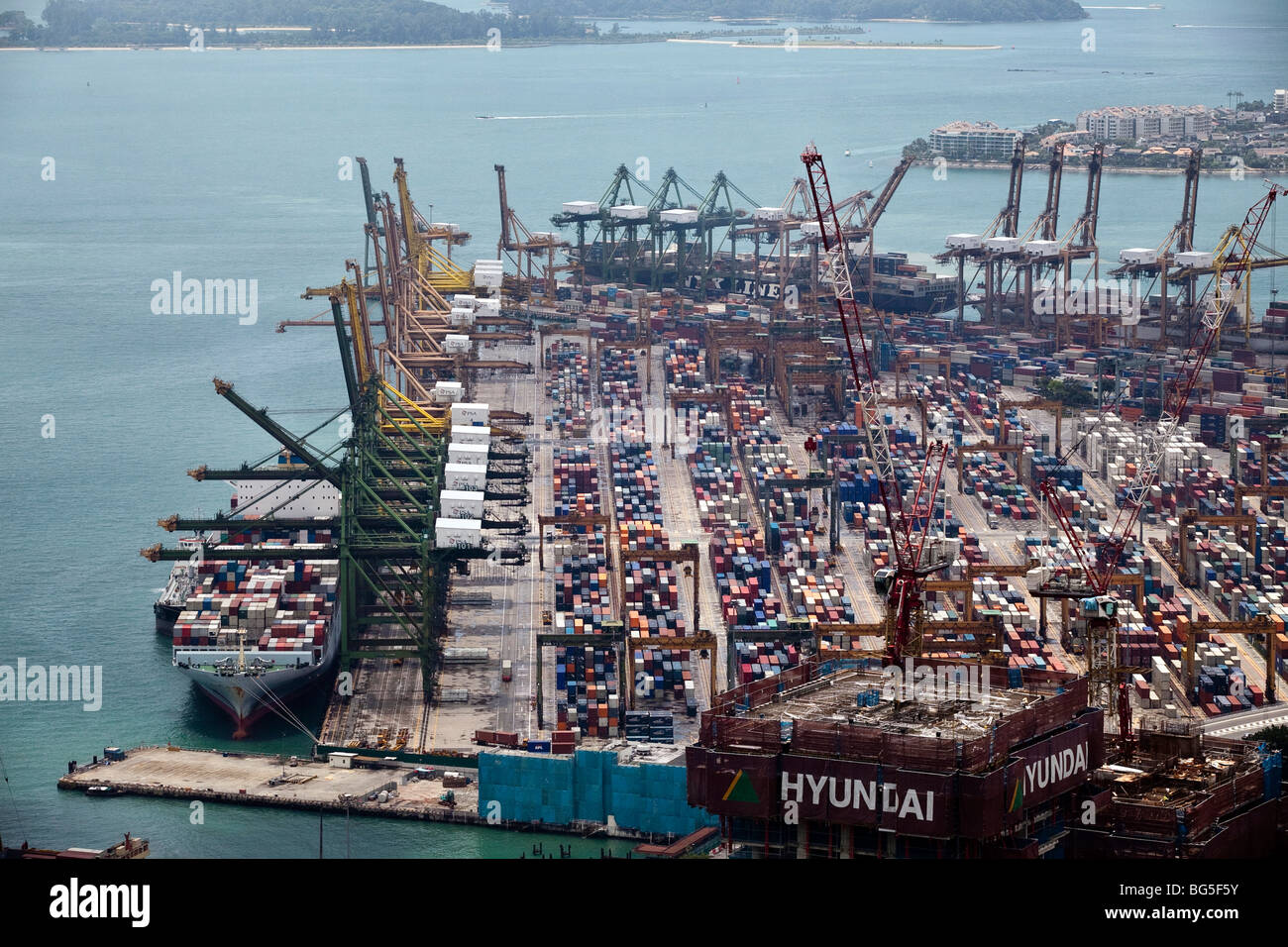 An elevated view shows a container ship docked at at the Port of ...
