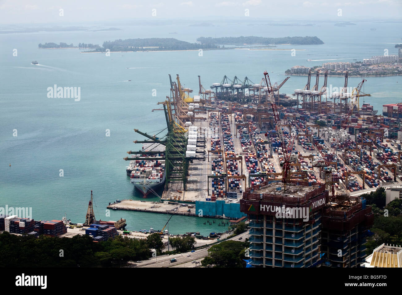 An elevated view shows a container ship docked at at the Port of ...