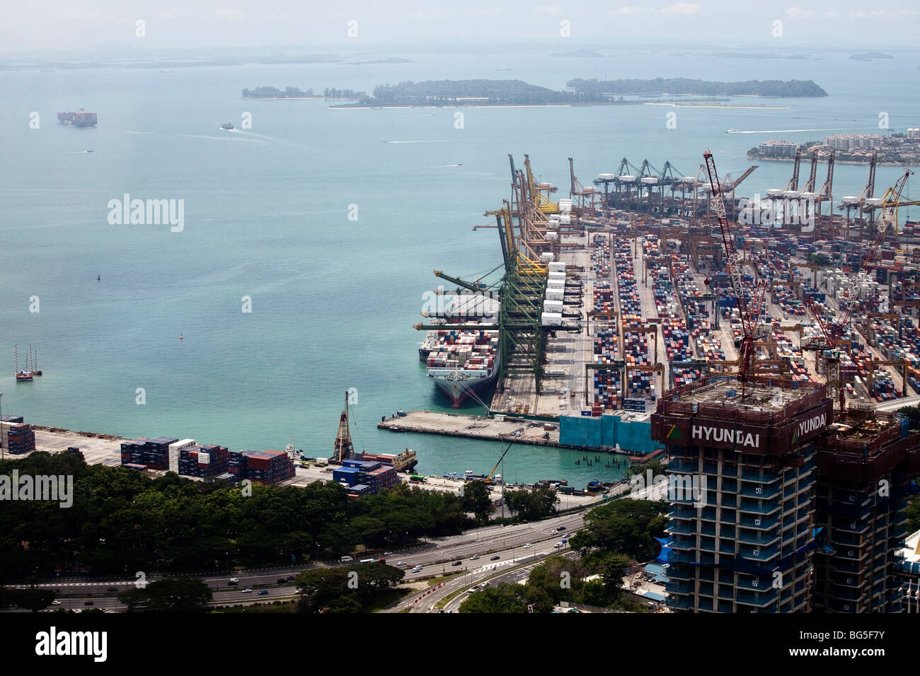 An elevated view shows a container ship docked at at the Port of ...