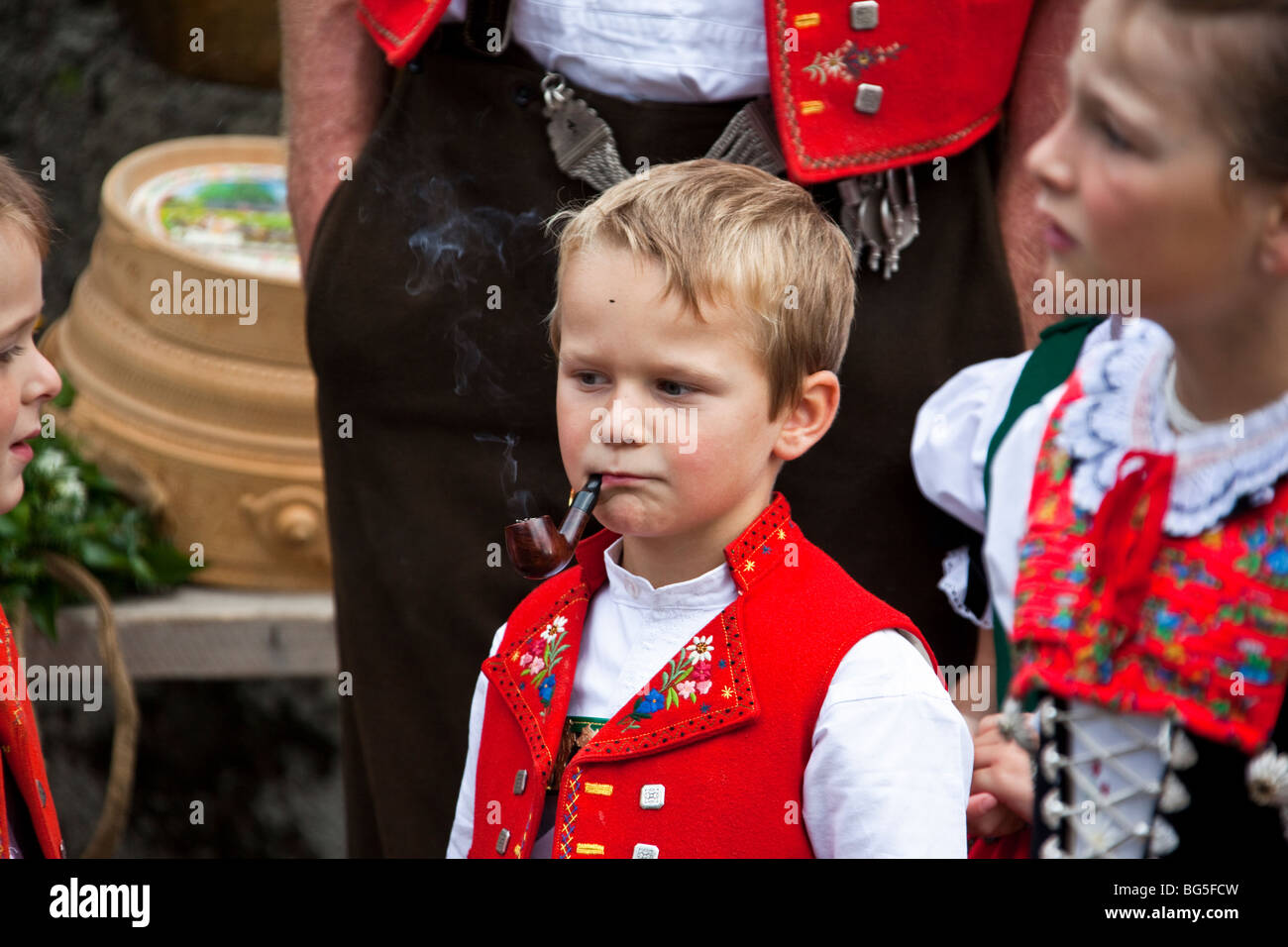 Young boy smoking pipe at Autumn cattle show in Appenzell - Switzerland ...