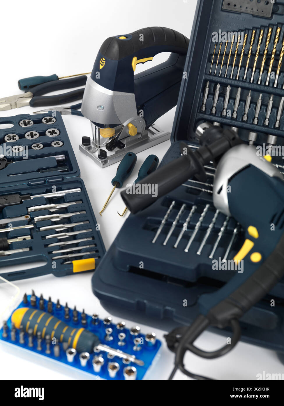 Electric drill, a jigsaw, thread cutting dies and taps, drill bits and ...