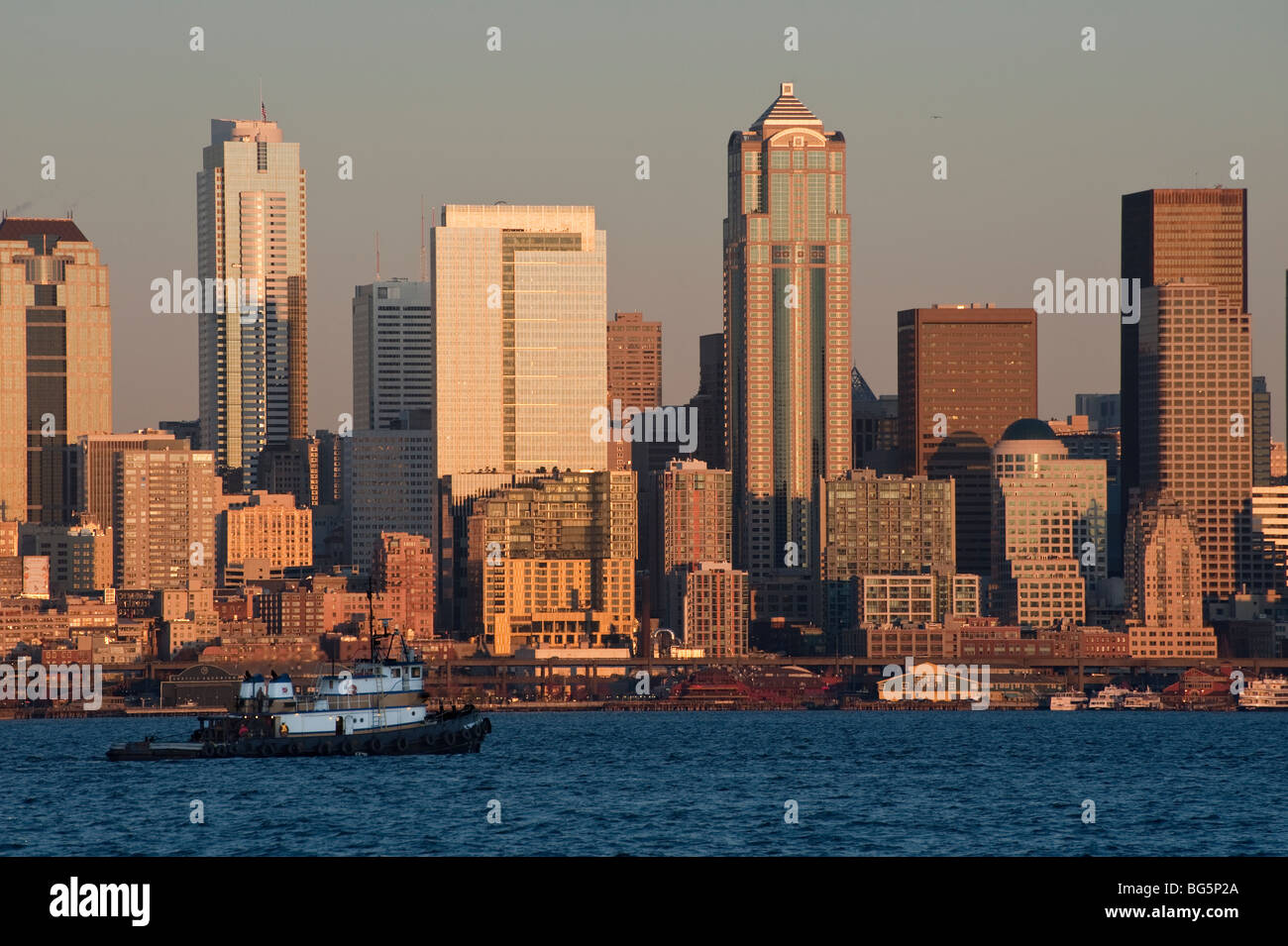 A beautiful winter sunset reflects off of the Seattle, Washington ...