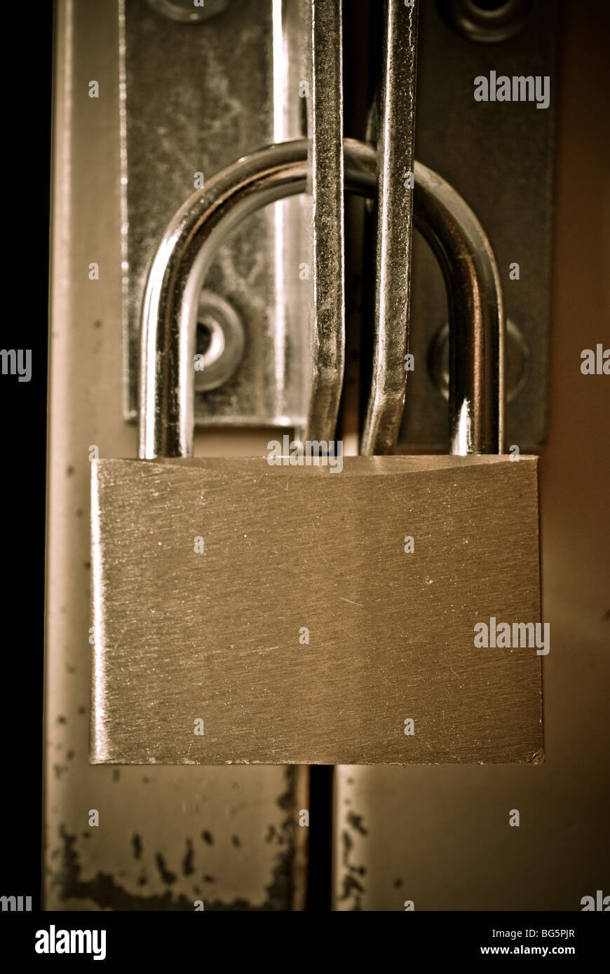 Traditional brass padlock attached to a locker Stock Photo - Alamy