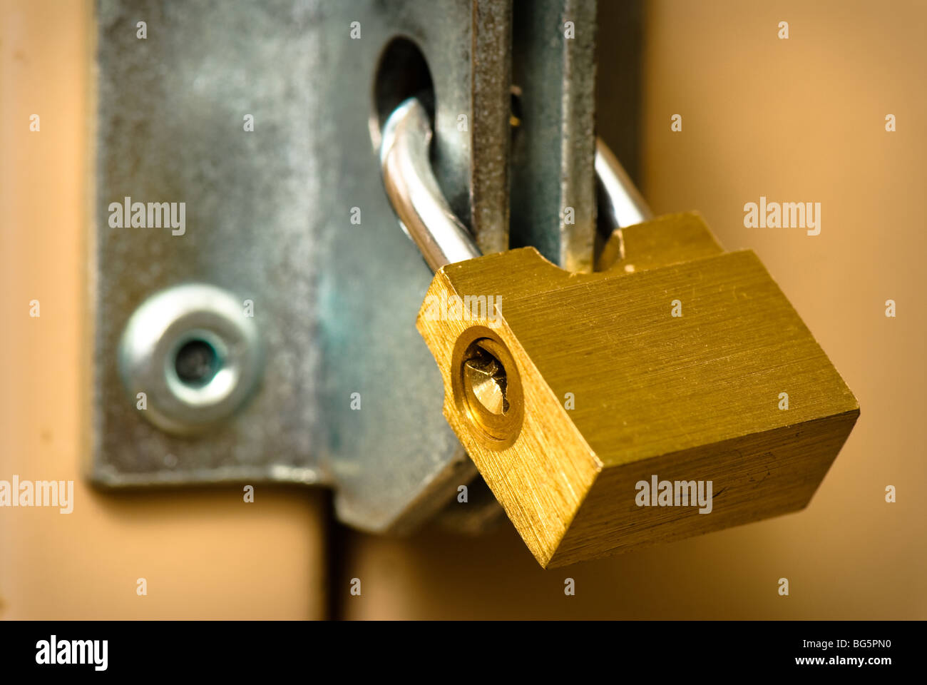 Traditional brass padlock with keyhole attached to a locker Stock Photo ...