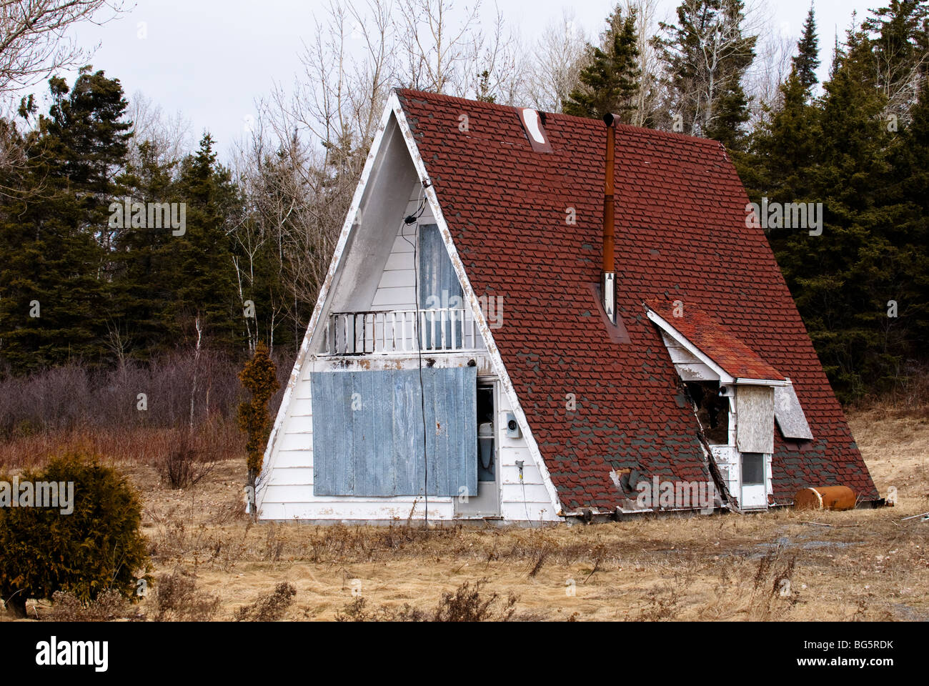 Small abandoned A-frame house Stock Photo - Alamy