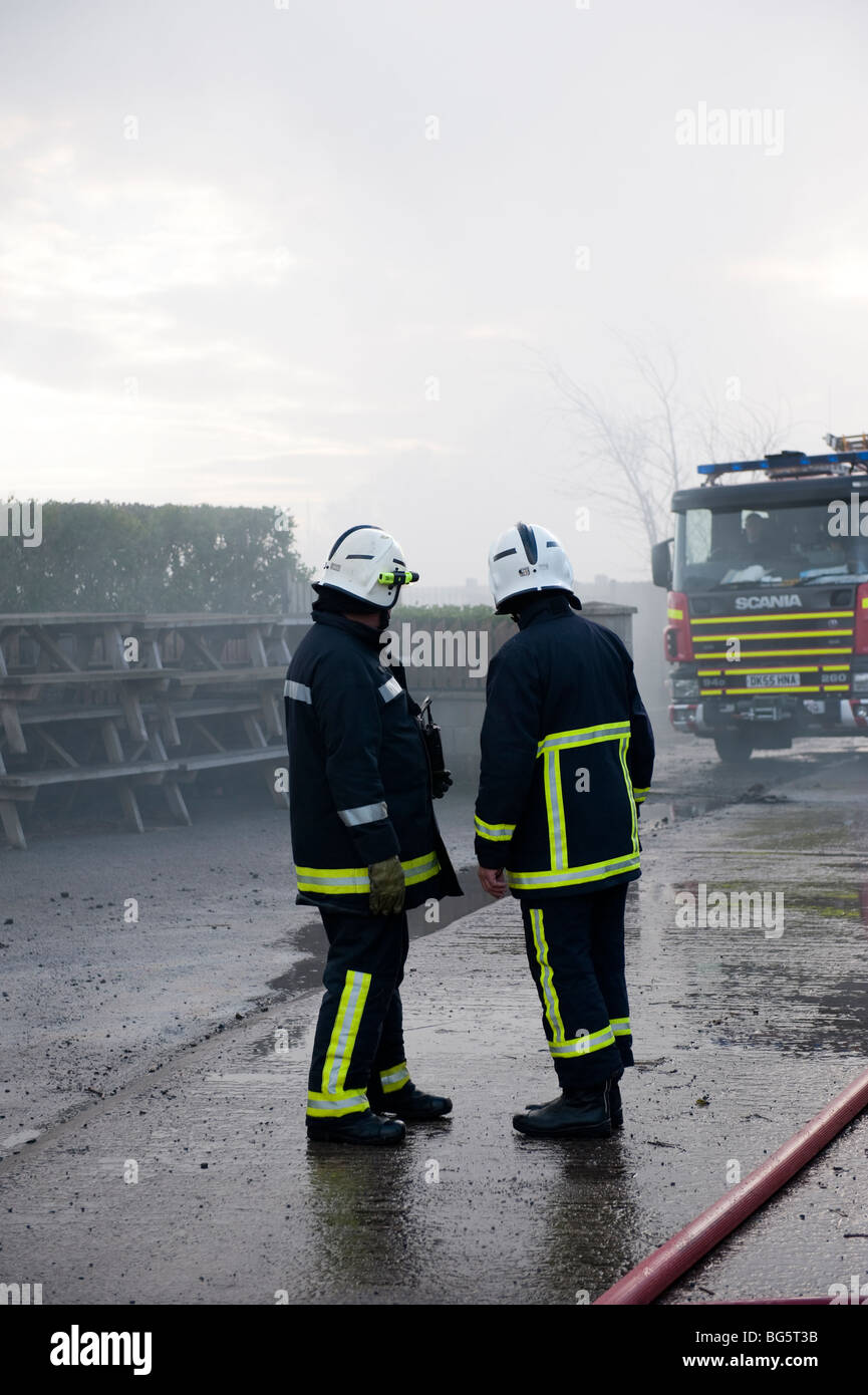 Two senior Firemen with Fire Engine Stock Photo - Alamy