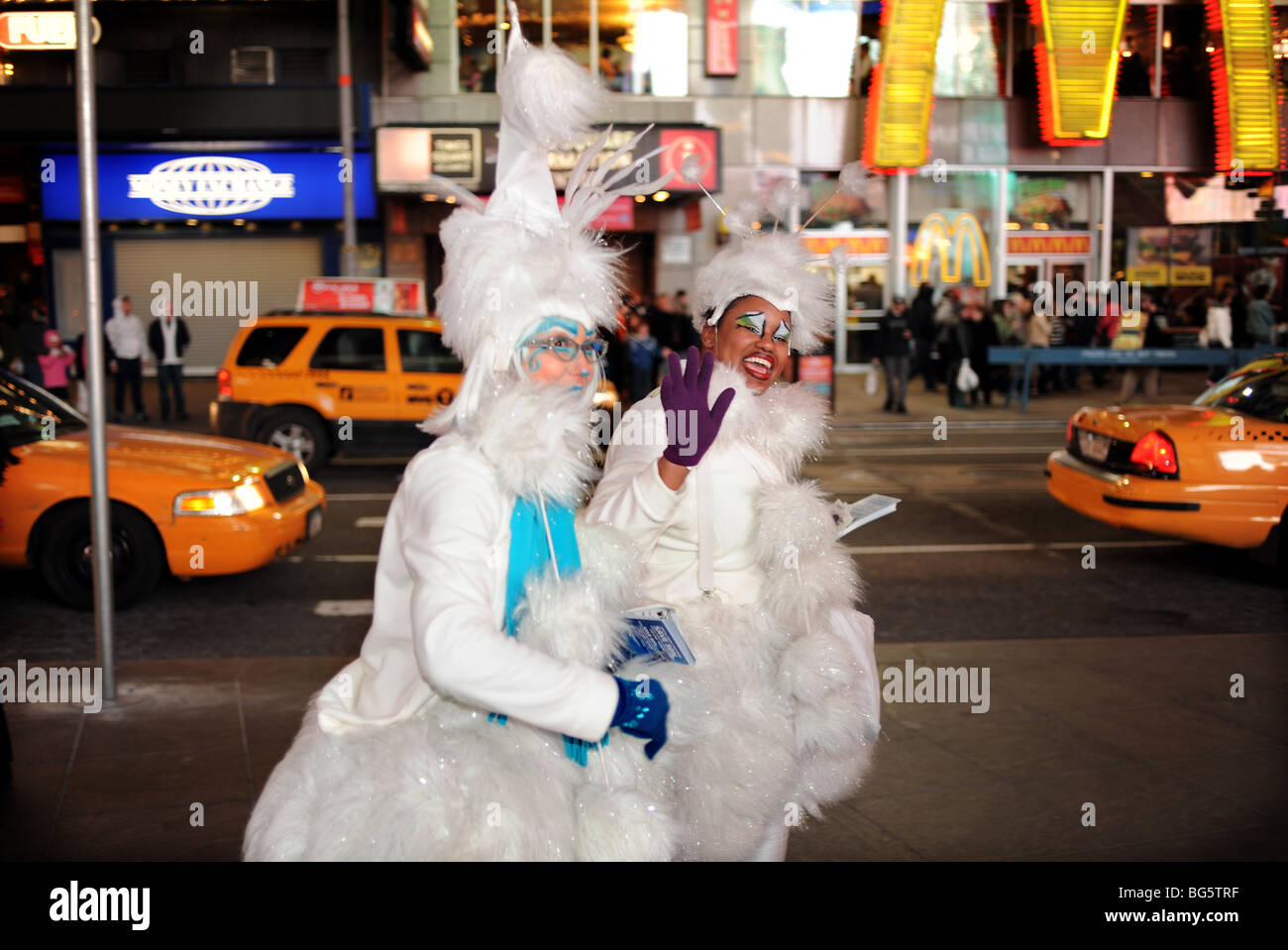 Party goers in fancy dress at Times Square in New York USA Stock Photo ...