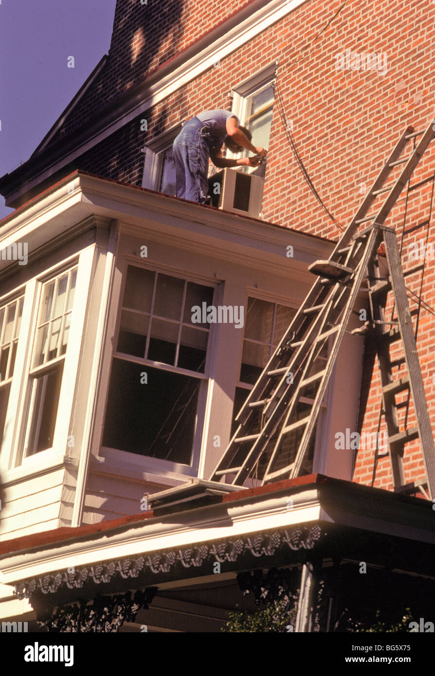 One male man fixes window Stock Photo - Alamy