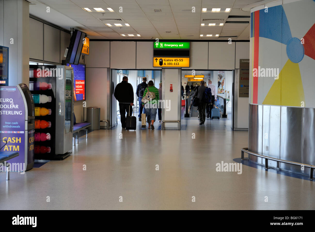 Inside airport departure terminal Gatwick North, long walk to gates ...