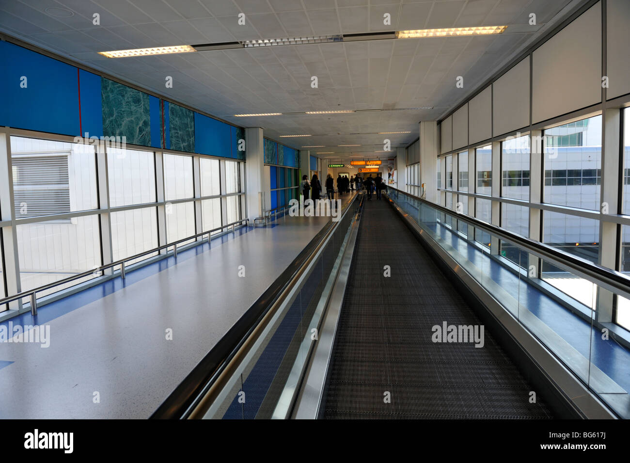 Inside airport departure terminal Gatwick North, long walk to gates ...