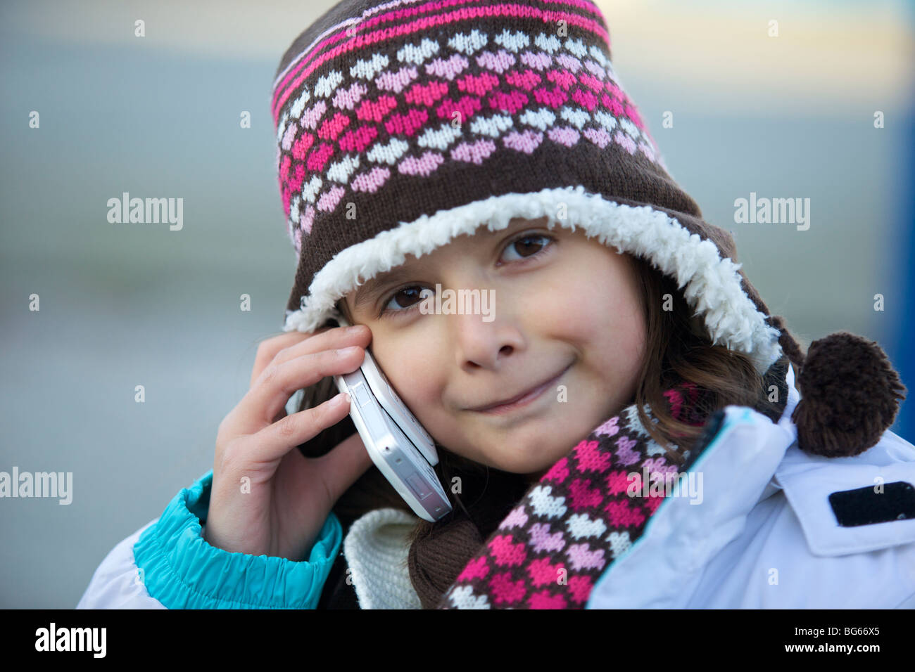 Young girl calling her parents after school with a cellphone Stock ...