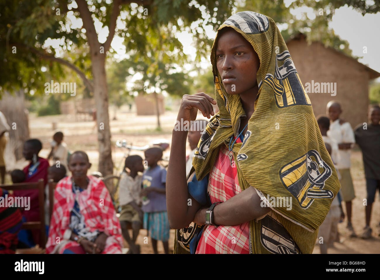 A Maasai woman in traditional dress waits outside a clinic in Kilombero ...