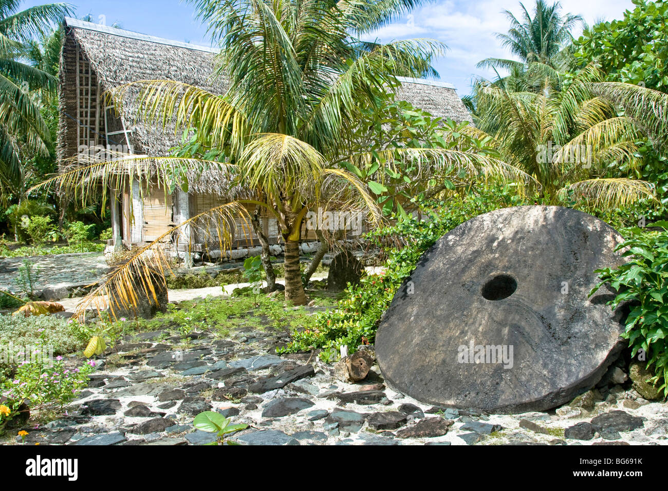 Traditional Stone Money or Rai in front of Pebau or Traditional ...