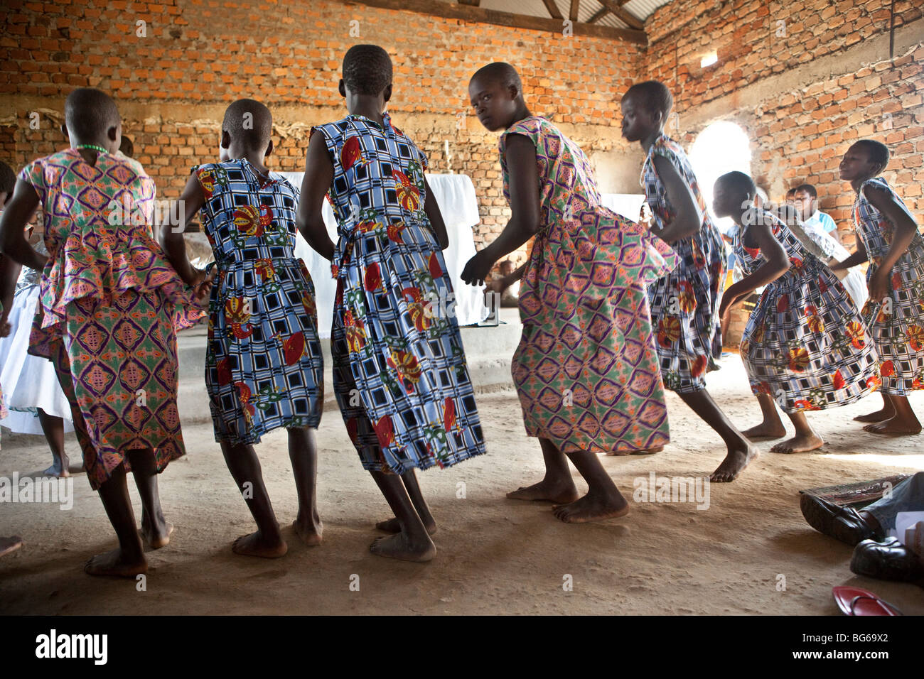Shoeless girls dance at the Catholic Church in Amuria, Teso subregion ...