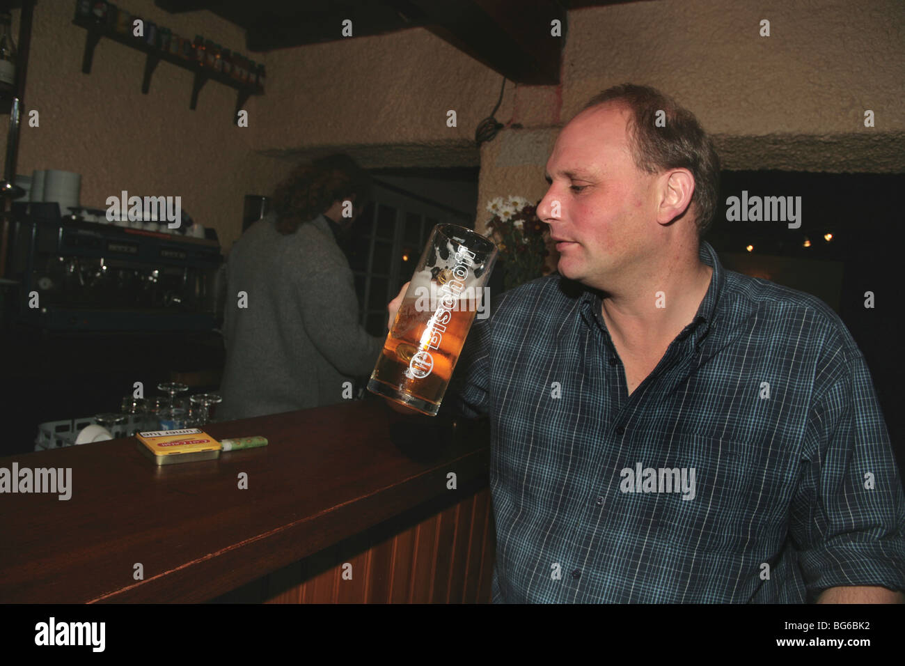 Man drinking a pint of beer Stock Photo - Alamy