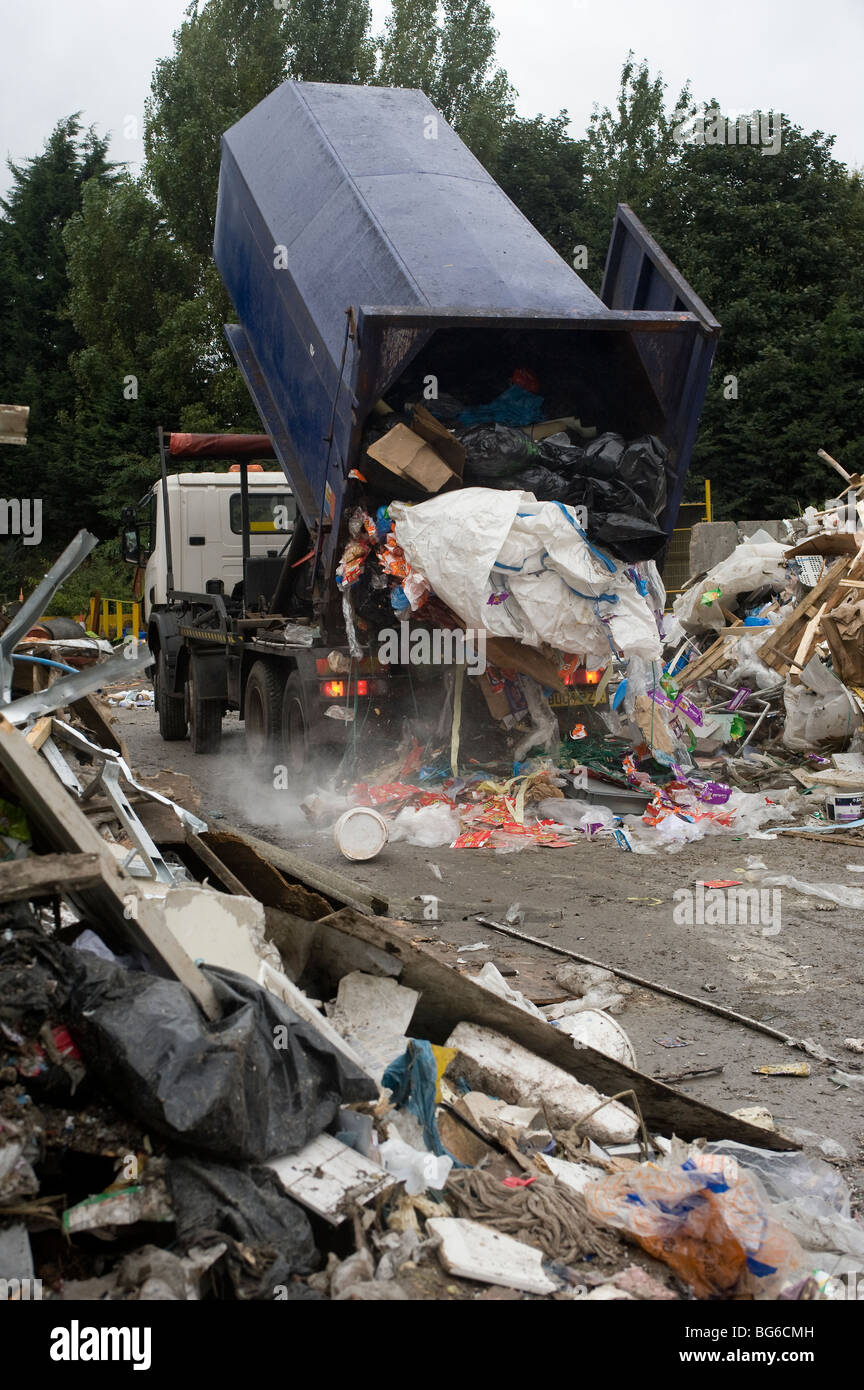 Lorry tipping rubbish at a materials recycling facility in England ...