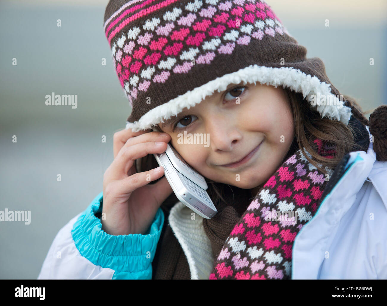 Young girl calling her parents after school with a cellphone Stock ...