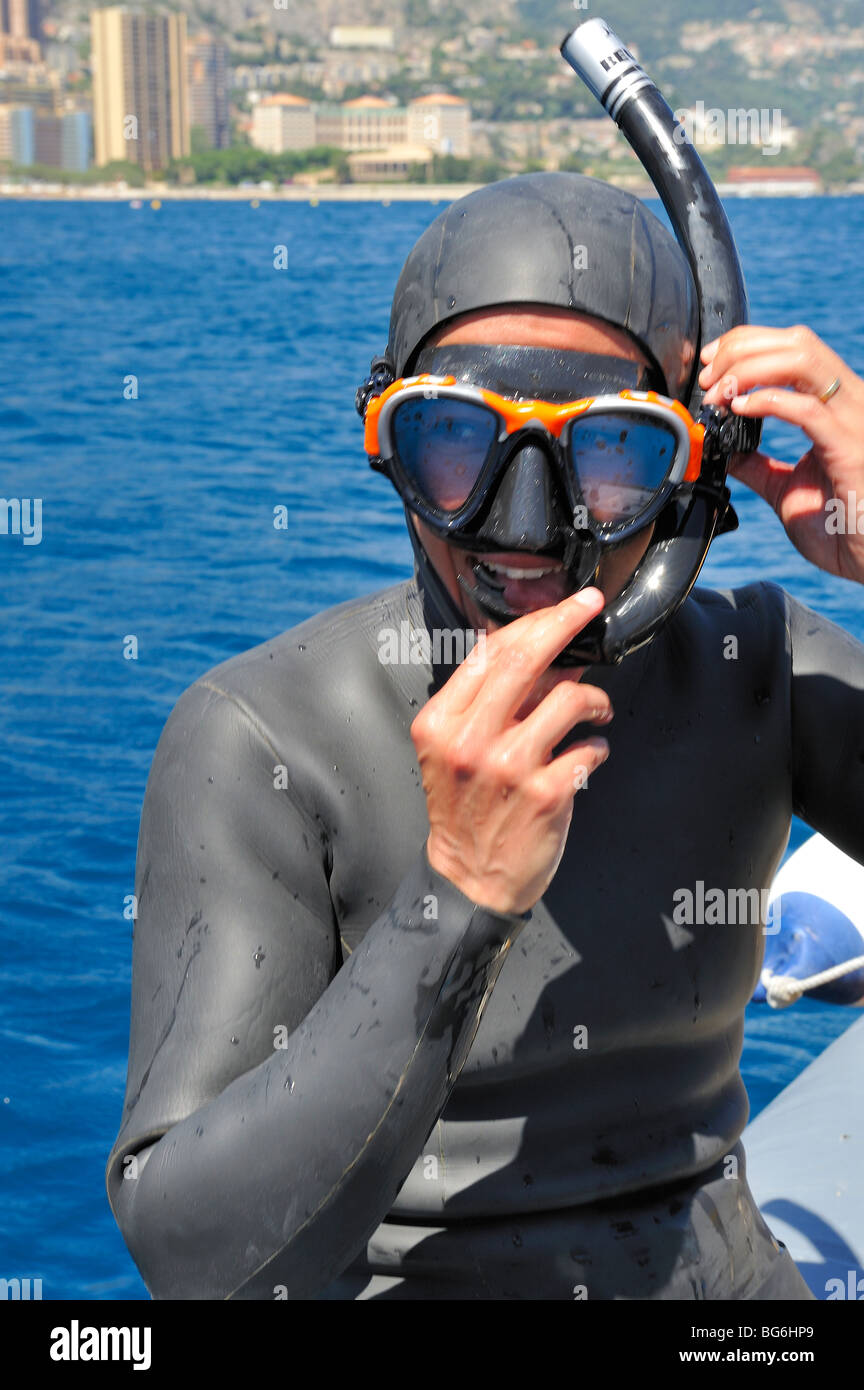 In mediterranean sea she is sitting on an inflatable boat hi-res stock ...