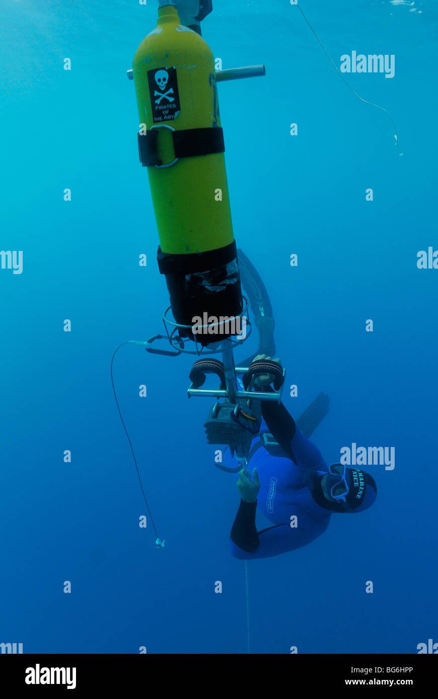 A free diver setting a device used for the no-limit apnea immersion ...