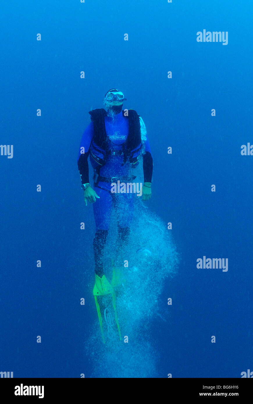 Free diver going up with an inflatable BCD in the Mediterranean Sea ...