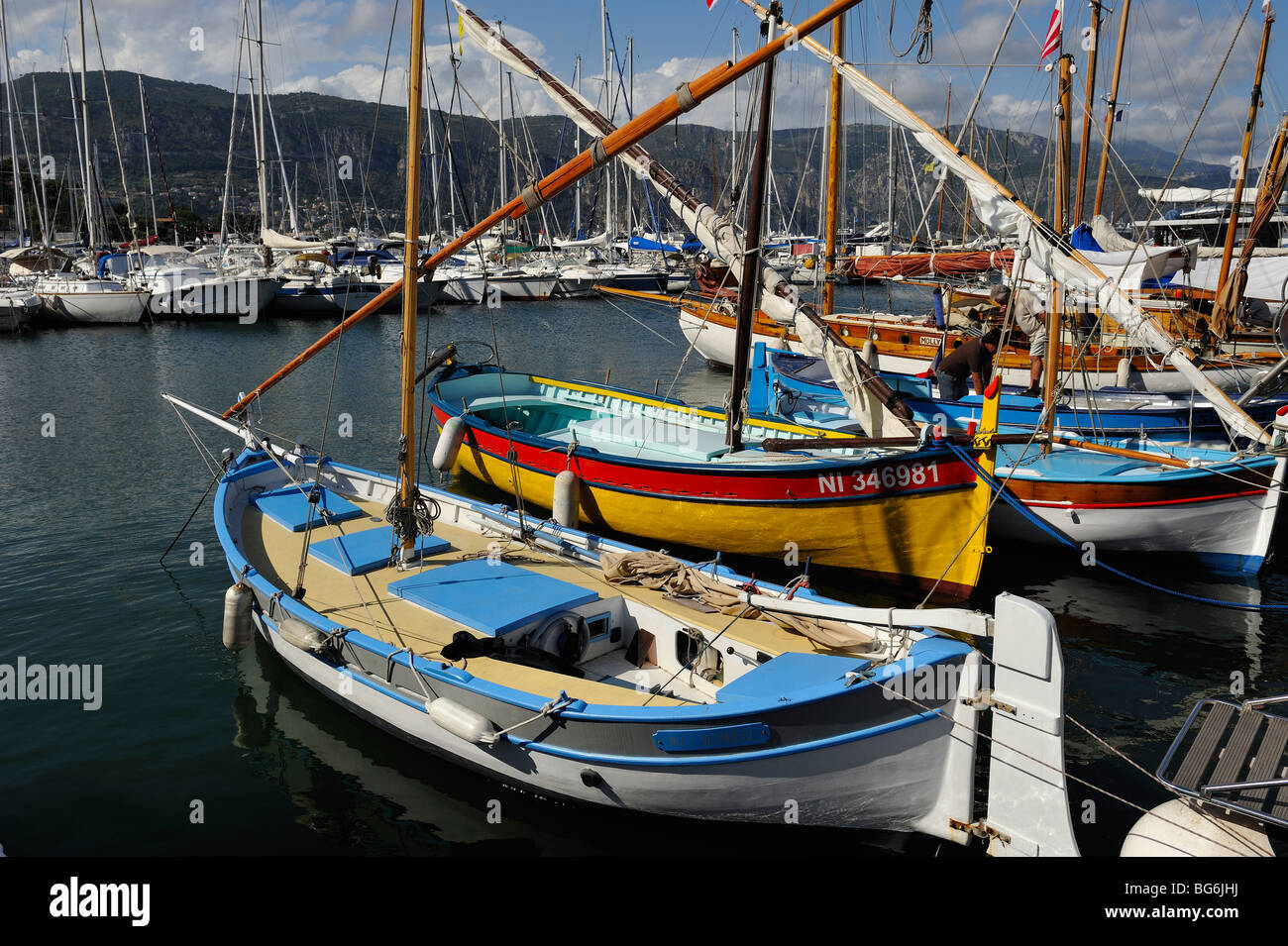 Small wood fishing boats moored in Saint Jean Cap Ferrat harbour ...