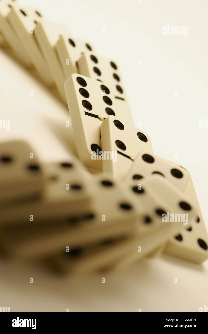Fallen dominoes hi-res stock photography and images - Alamy