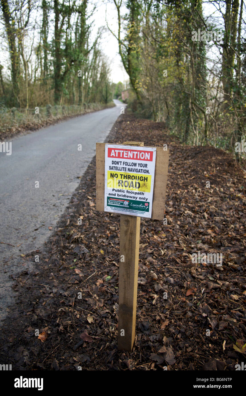 Do not follow satnav sign on small country road Stock Photo - Alamy
