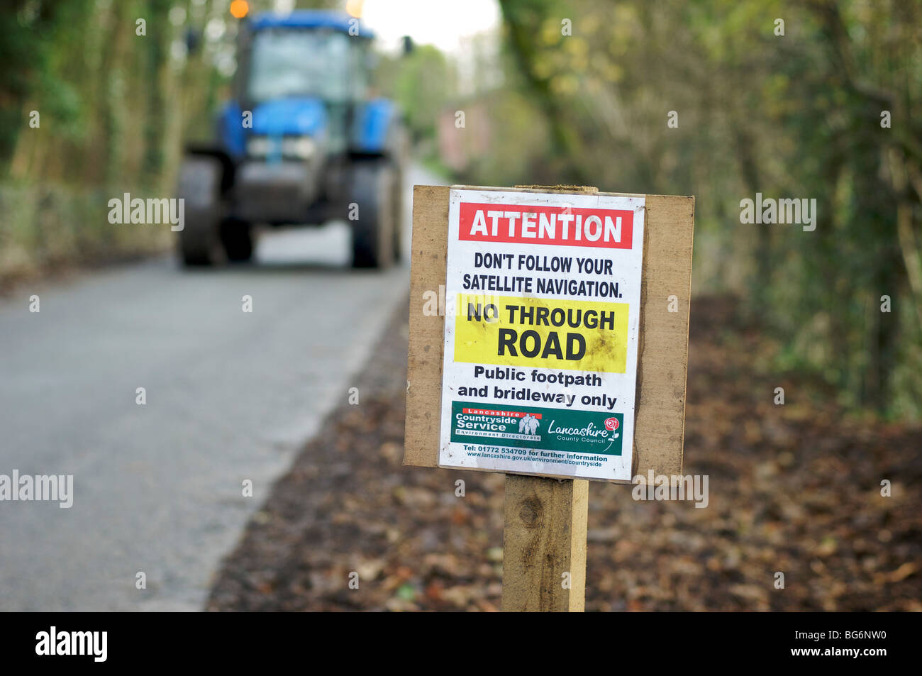 Do not follow satnav sign on small country road Stock Photo - Alamy