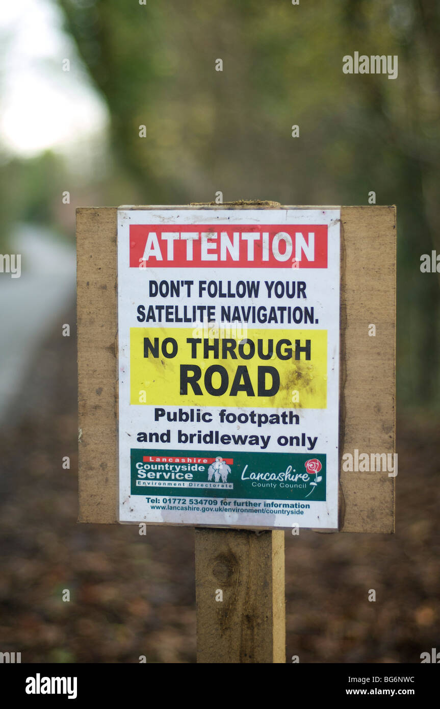 Do not follow satnav sign on small country road Stock Photo - Alamy
