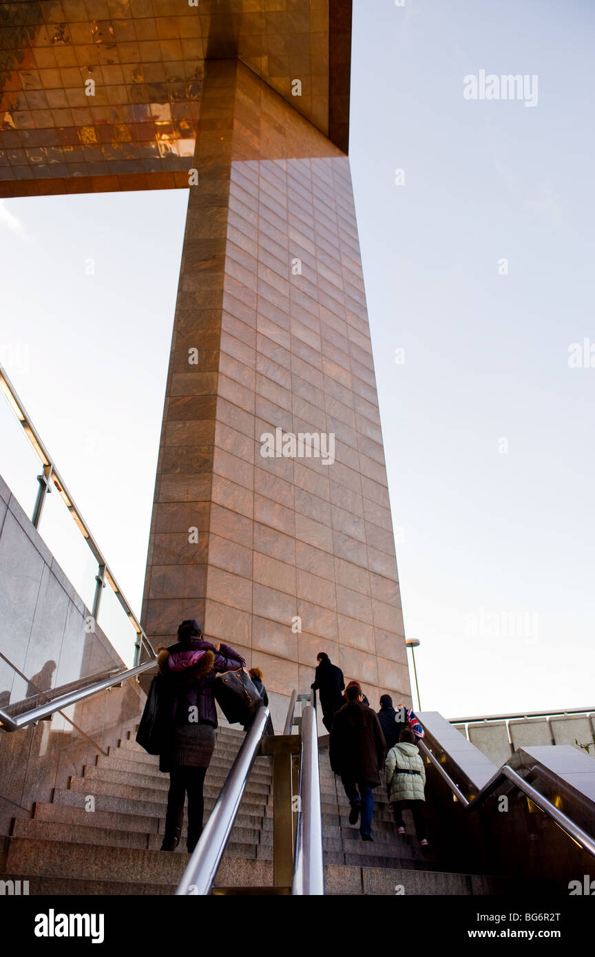 People walking up steps outside a modern building in London. Photo by ...