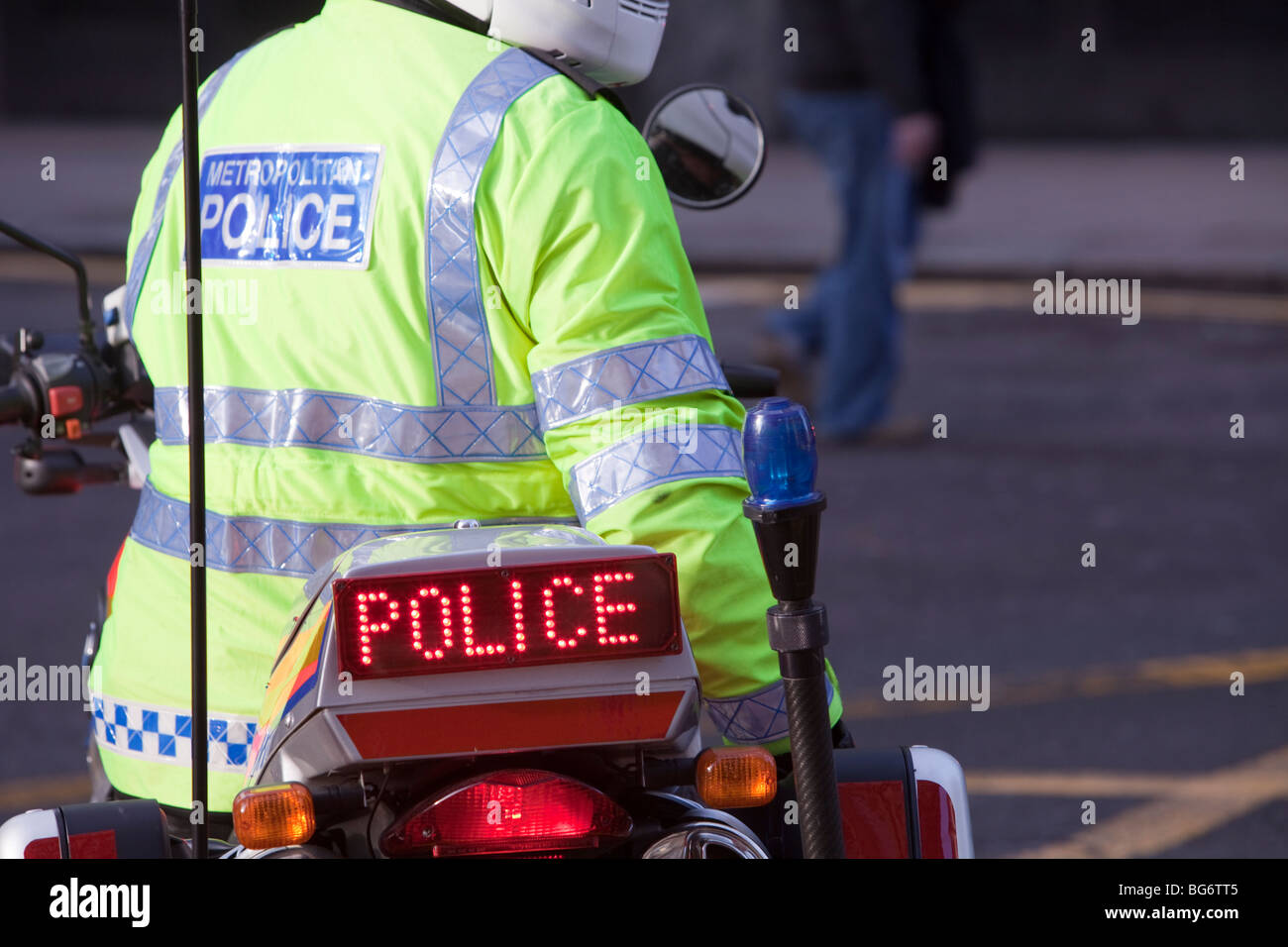 Police holding up traffic at a junction in London Stock Photo - Alamy