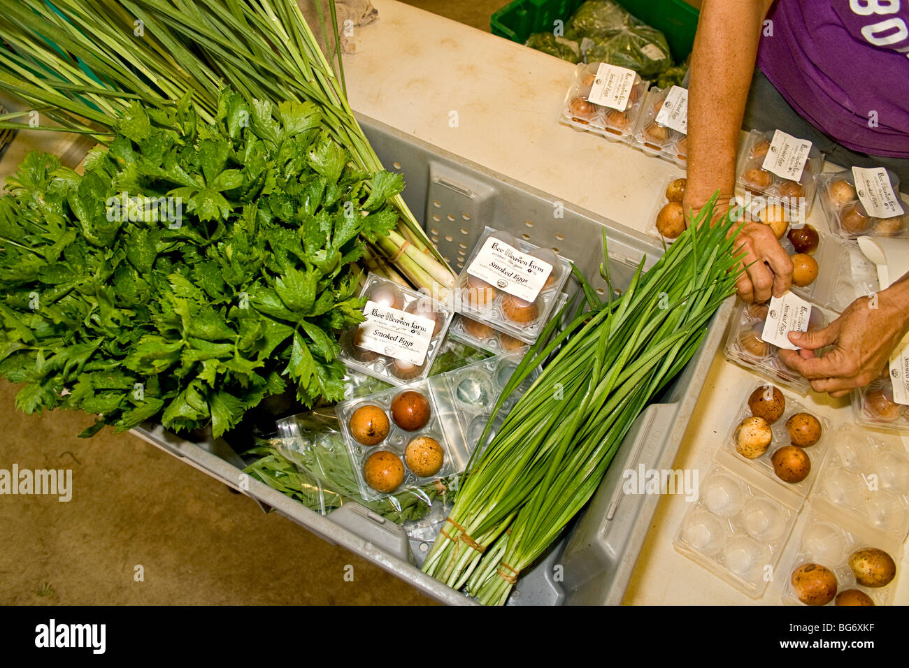 Organic produce packed for sale. The box includes from left to right ...