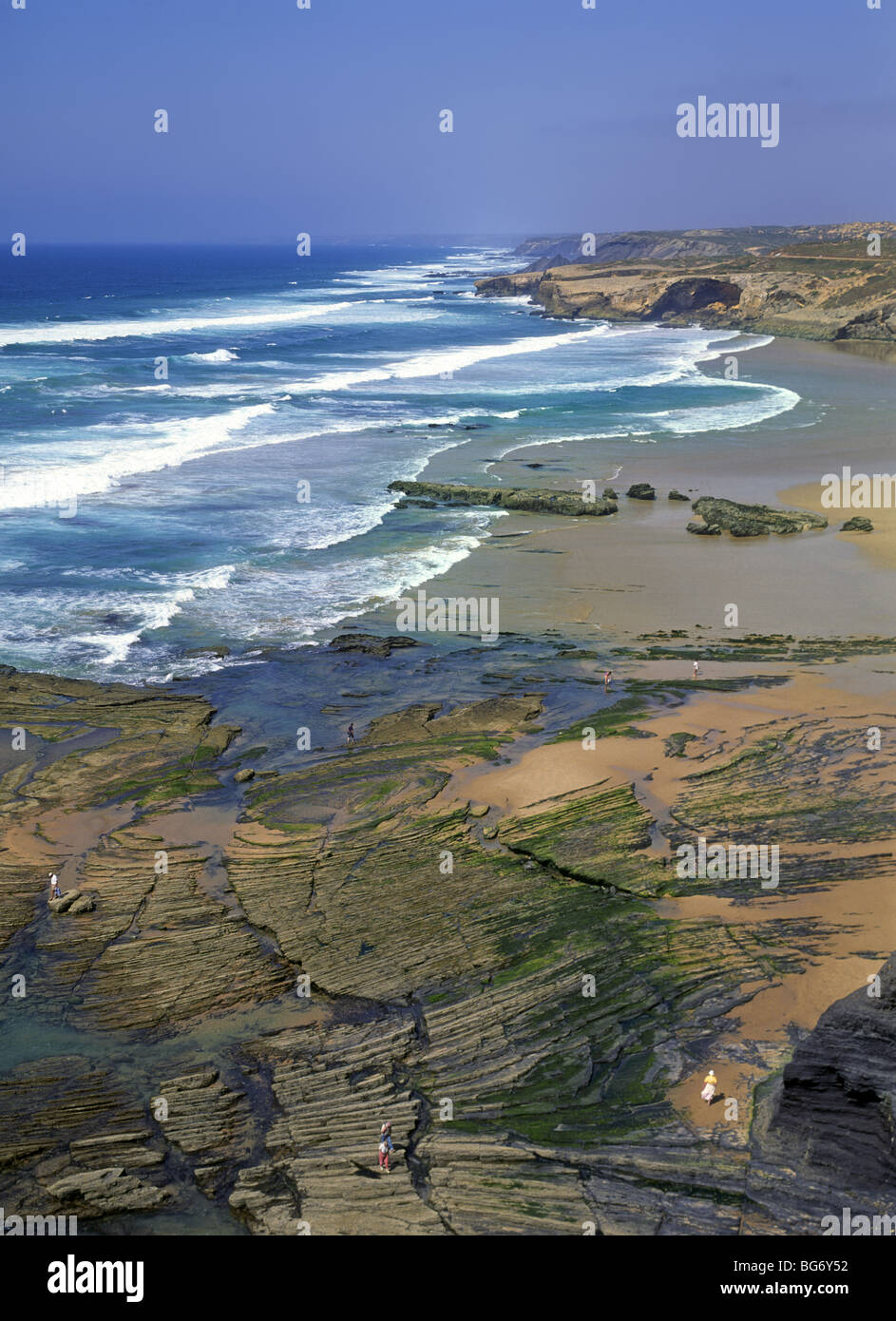 Beachcombing on unusual rock formations Stock Photo - Alamy