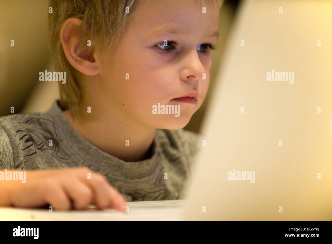 Boy with computer Stock Photo - Alamy
