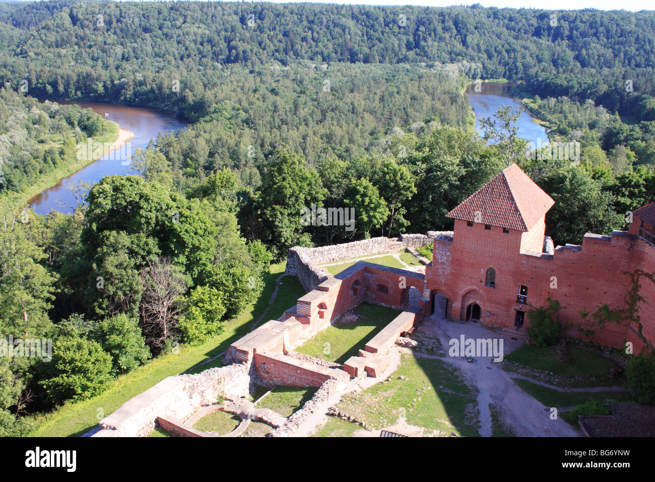 Medieval castle overlooking river bend Stock Photo - Alamy