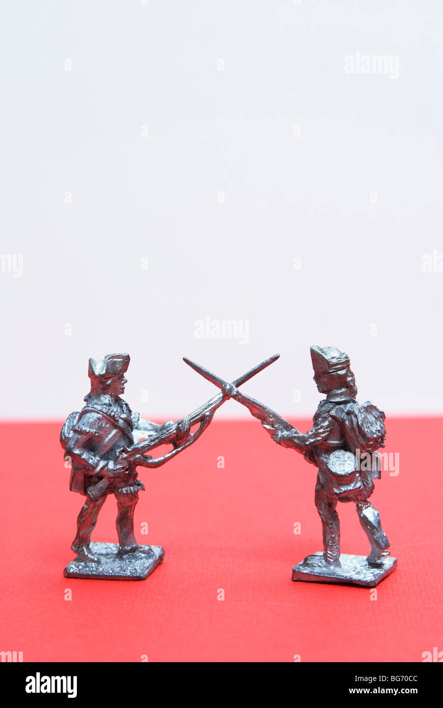 two toy soldiers crossing rifles Stock Photo - Alamy