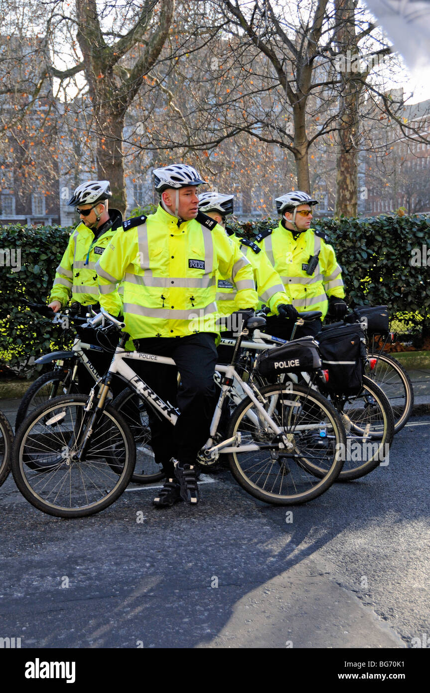 Metropolitan police officers on bikes at climate change march London ...